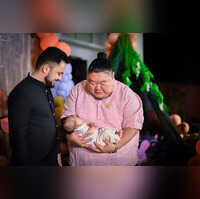 Nagaland Minister Temjen Imna Along cautiously holding a baby has ...