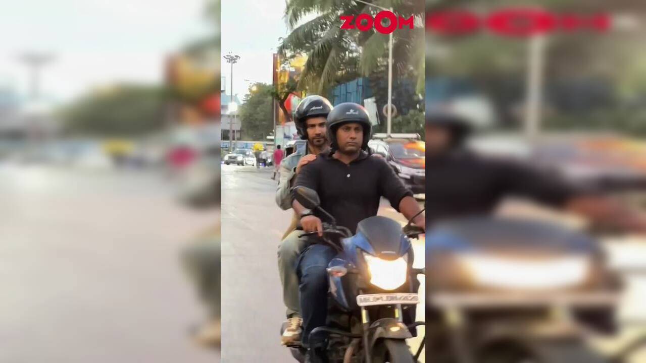 Varun Dhawan takes a bike ride wearing helmet | Viral Video