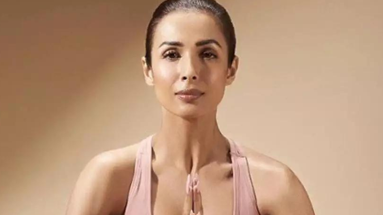 Malaika Arora flaunts her toned body as she aces poses on yoga day ...
